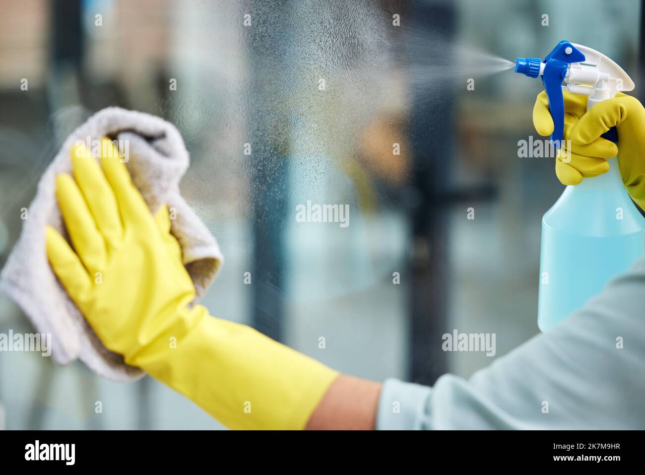 If you dont see your reflection, its not clean. a woman using a spray ...