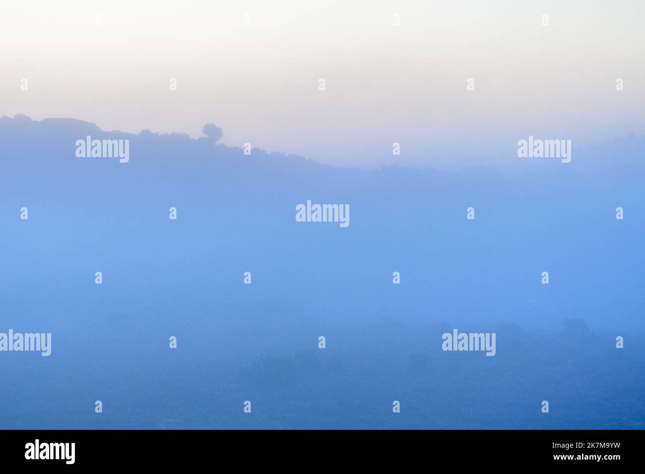 Cold autumn morning with mist and fog over countryside landscape, UK ...