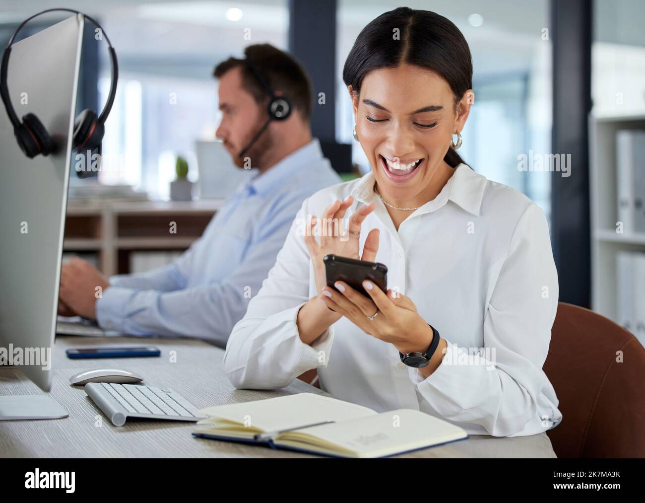 Your direct line to the get it done department. a young woman using a ...