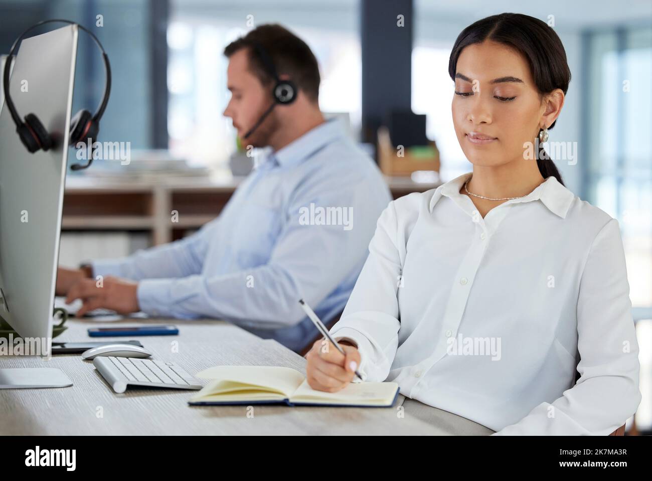 Serious woman talking note book hi-res stock photography and images - Alamy