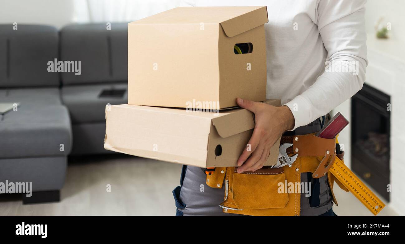 Young man working at a warehouse with boxes Stock Photo - Alamy