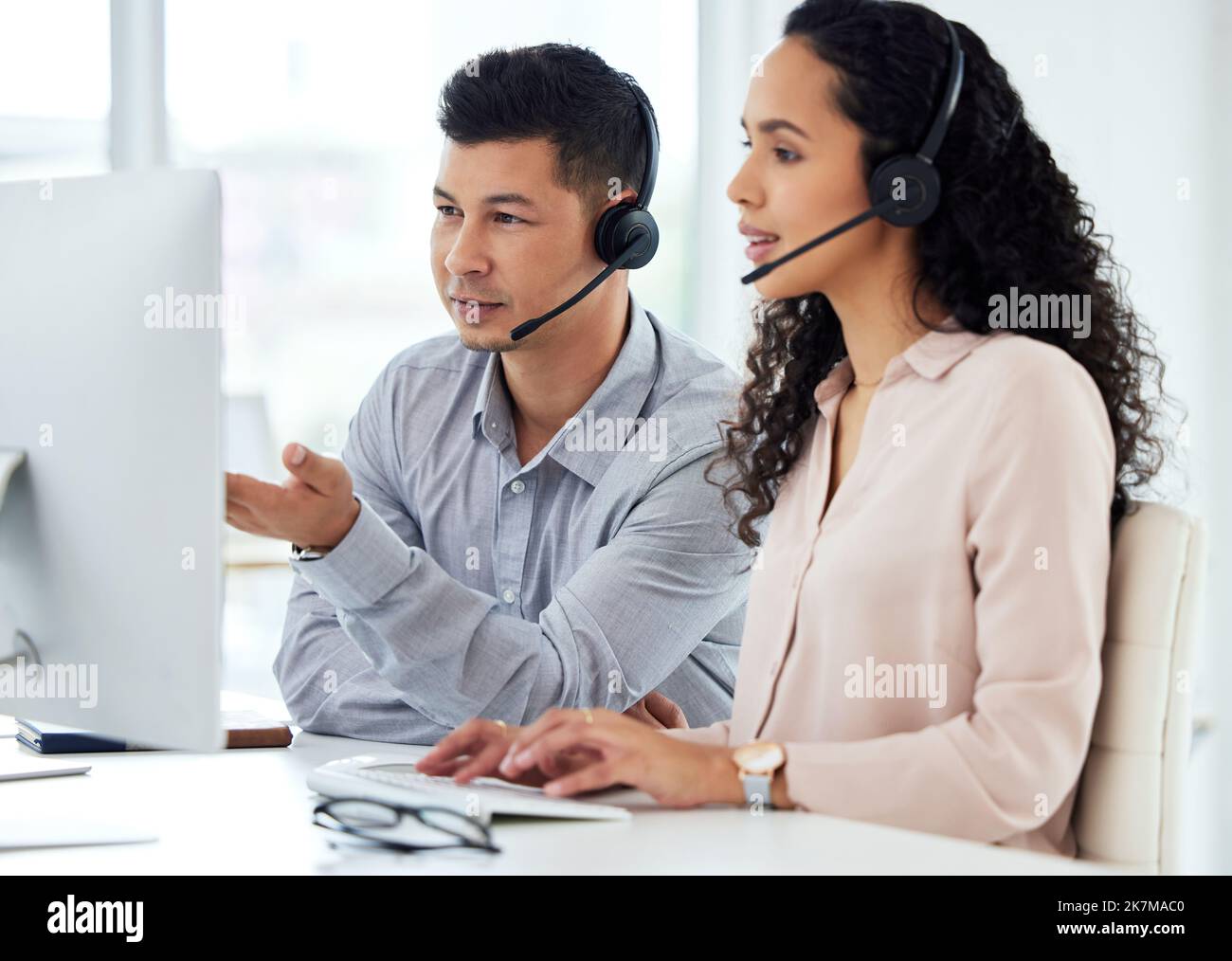 Well figure this out together. two call centre agents working together ...