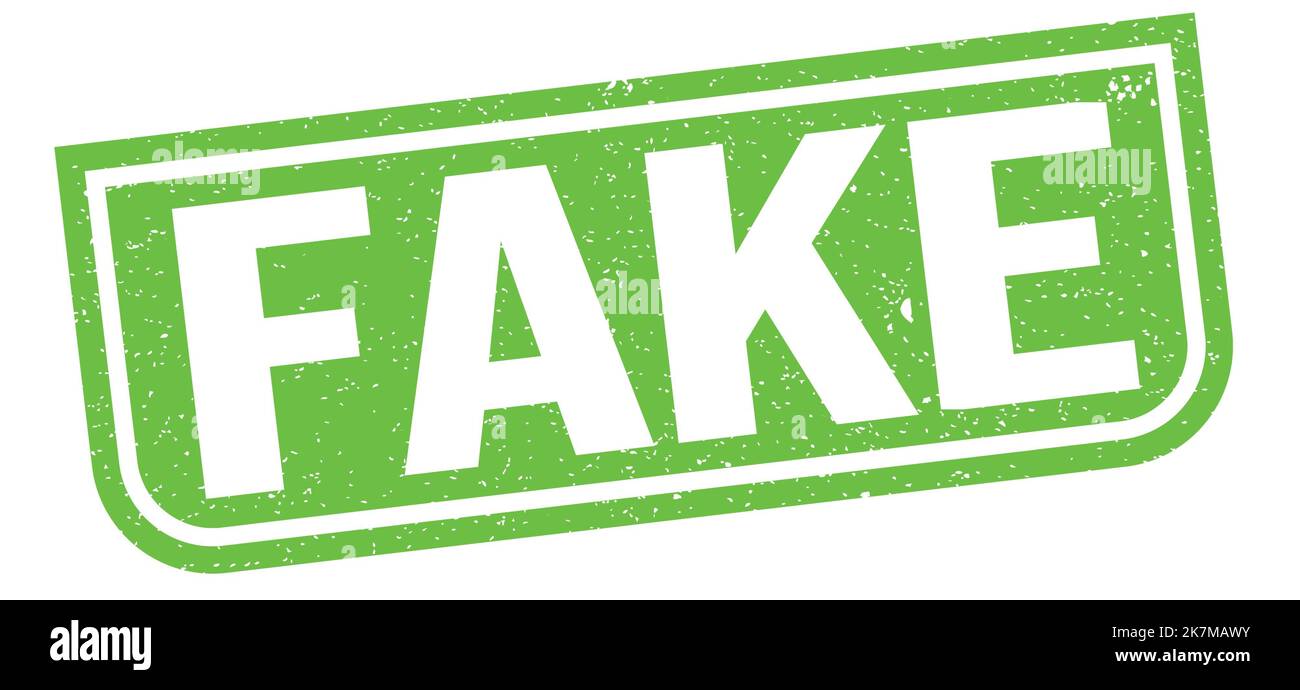 FAKE text written on green grungy stamp sign Stock Photo - Alamy