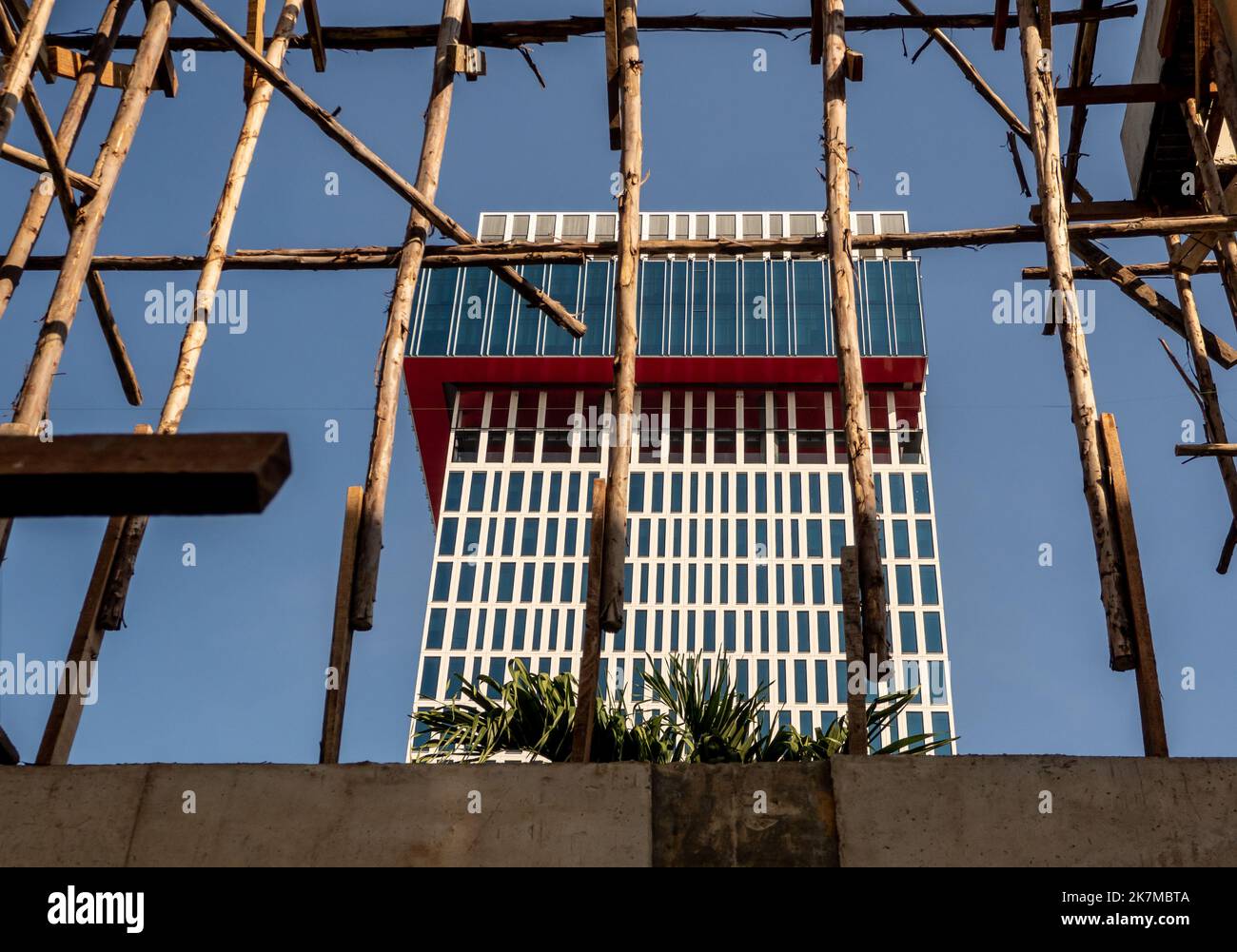 Temporary wooden pole for supports the concrete structure of a building ...