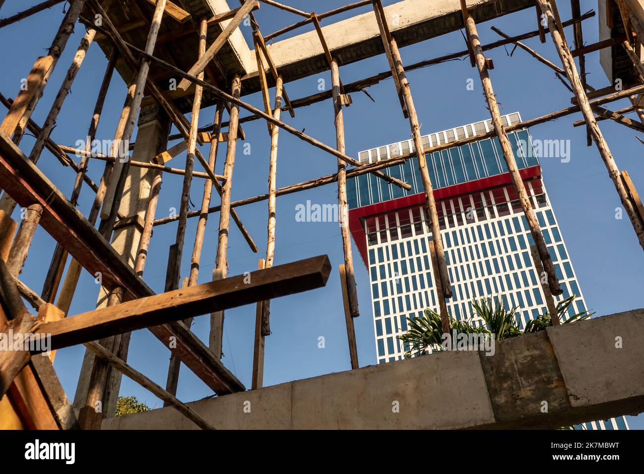 Temporary wooden pole for supports the concrete structure of a building ...