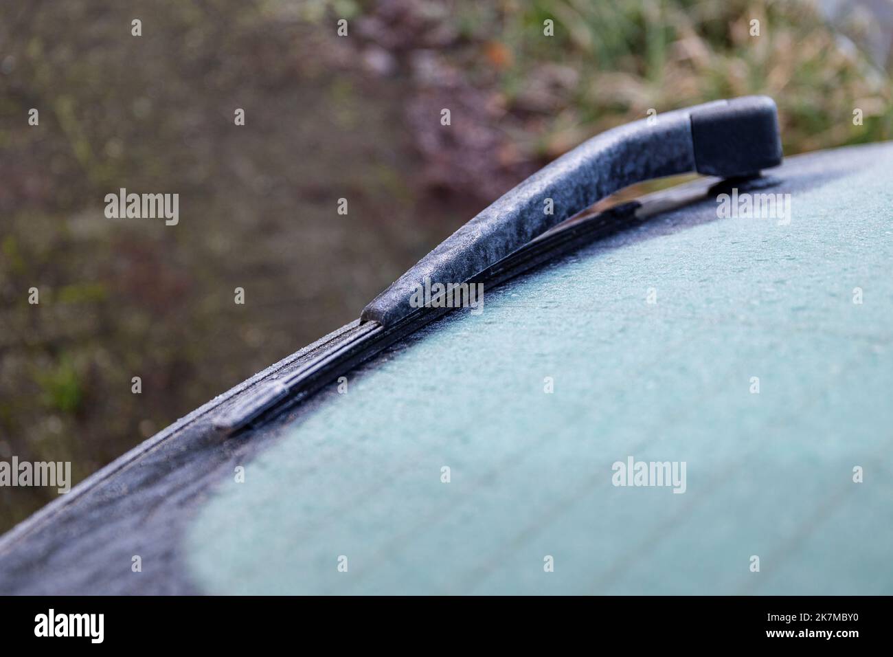 A close up portrait of a frozen back window of a car with a windshield ...