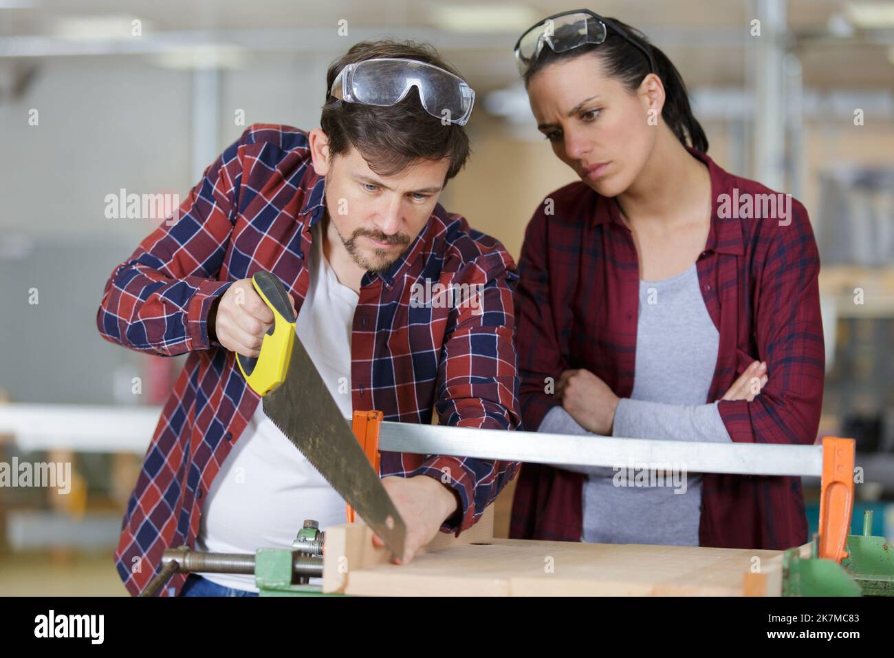 foreman showing apprentice how to saw wood on an angle Stock Photo - Alamy foreman showing apprentice how to saw wood on an angle Stock Photo - Alamy