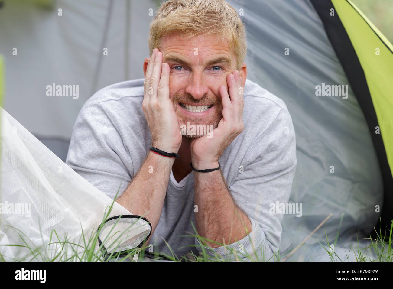 man in the tent in the camping Stock Photo - Alamy