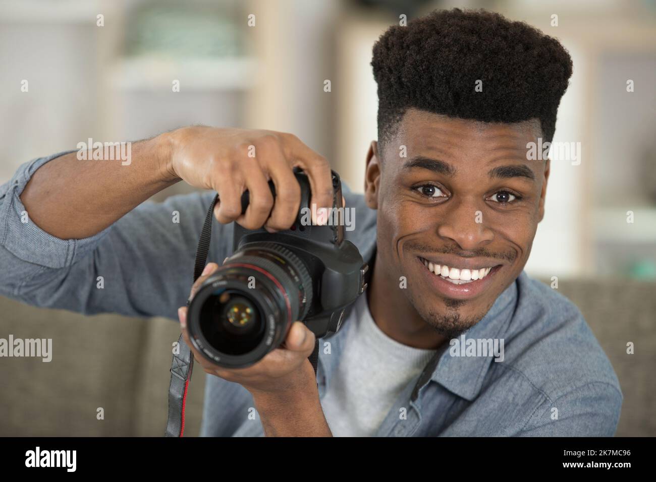 handsome guy ready to take photos Stock Photo - Alamy