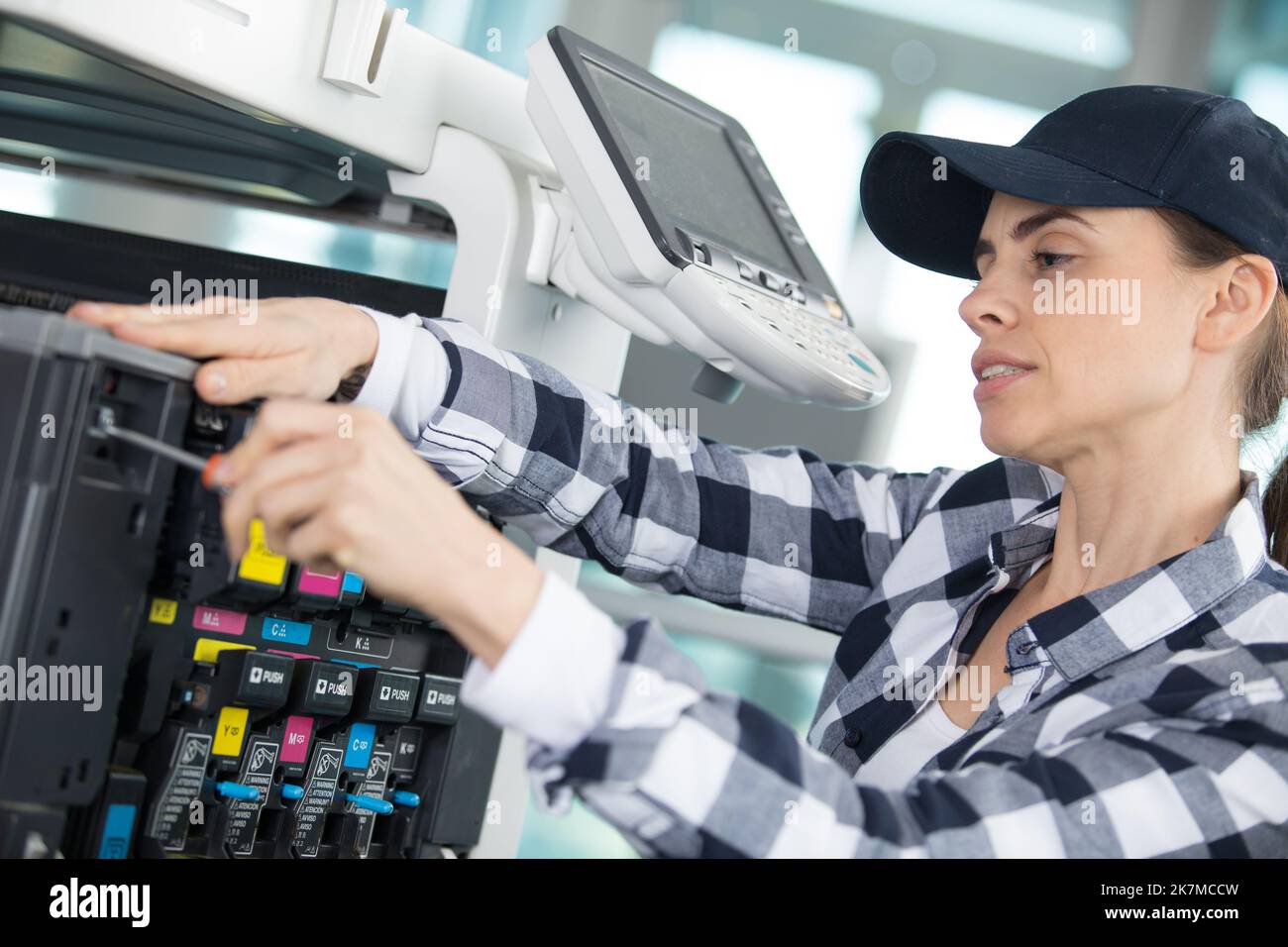 a woman fixing a printer Stock Photo - Alamy