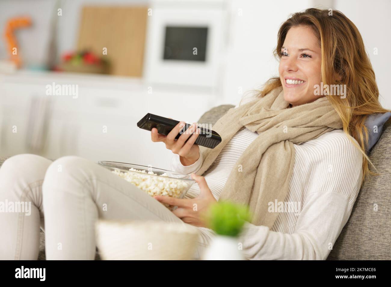 woman enjoying watching tv Stock Photo - Alamy