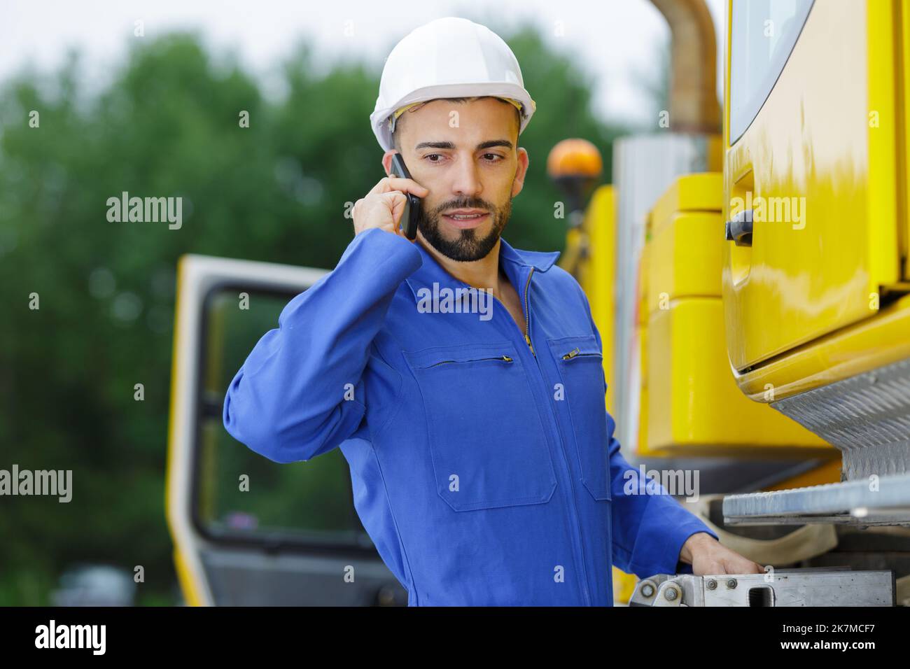 engineer builder on the phone at construction site Stock Photo - Alamy