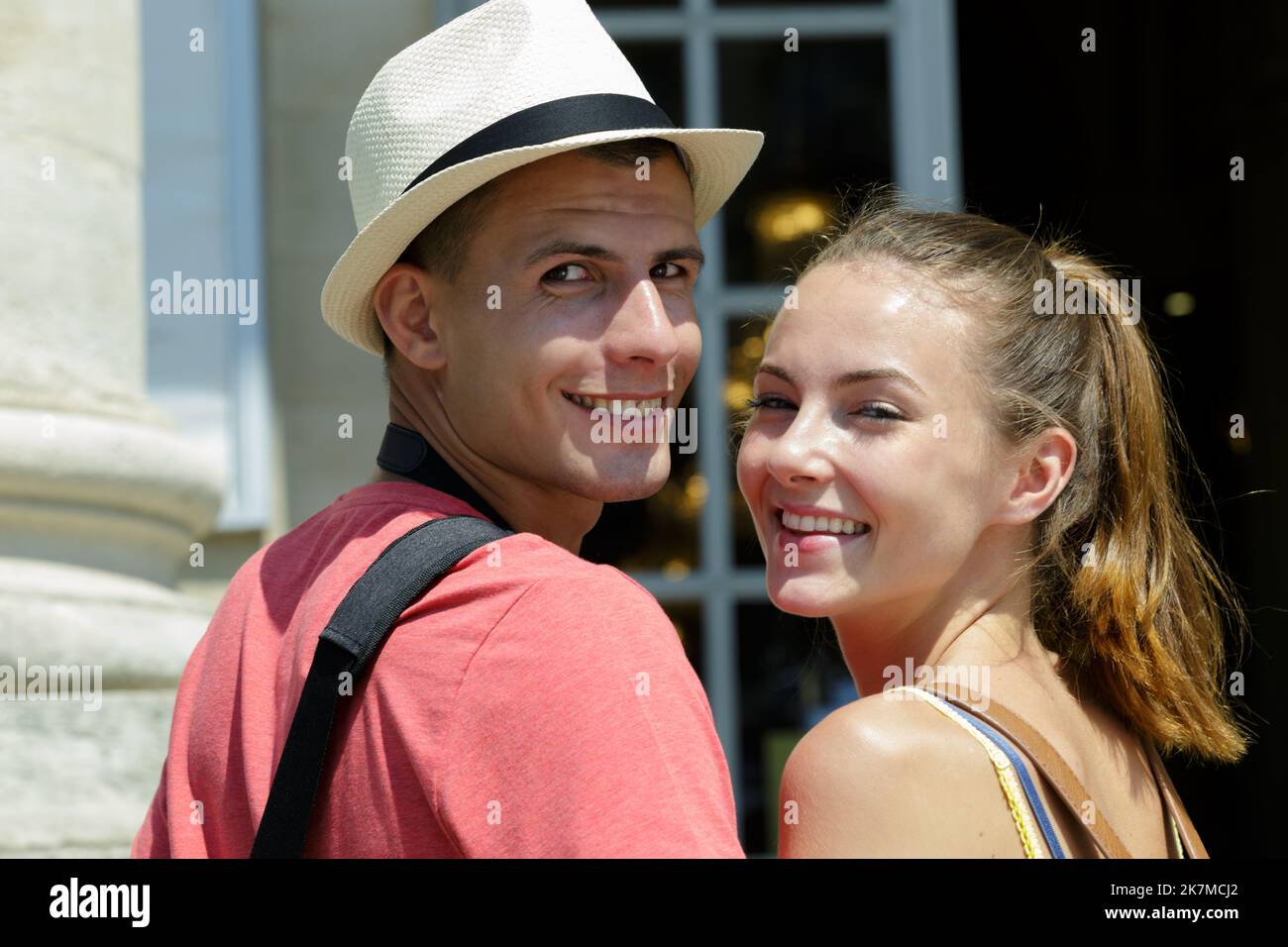 a young tourist smiling posing Stock Photo - Alamy