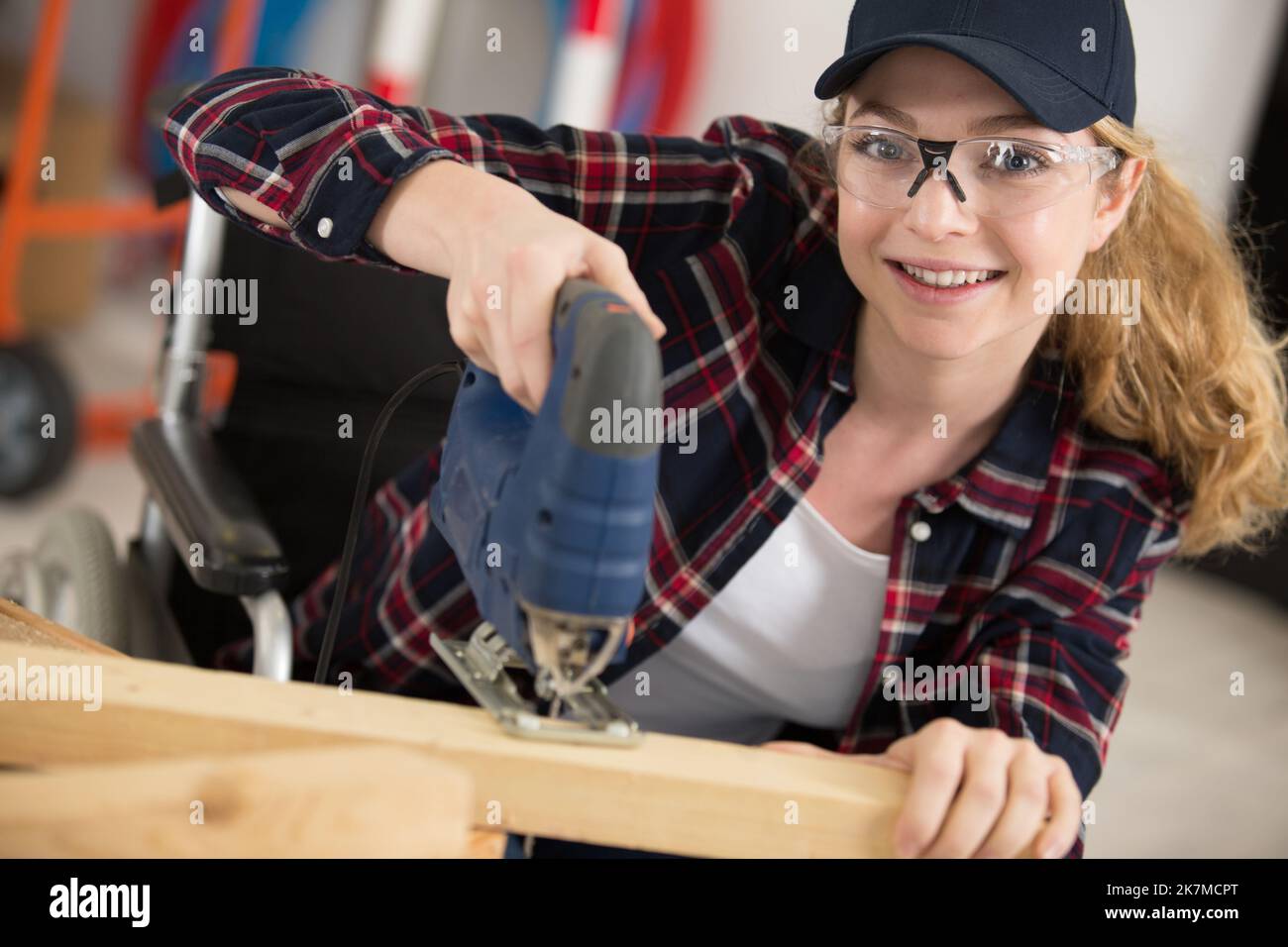 Cutting timber woman hi-res stock photography and images - Alamy
