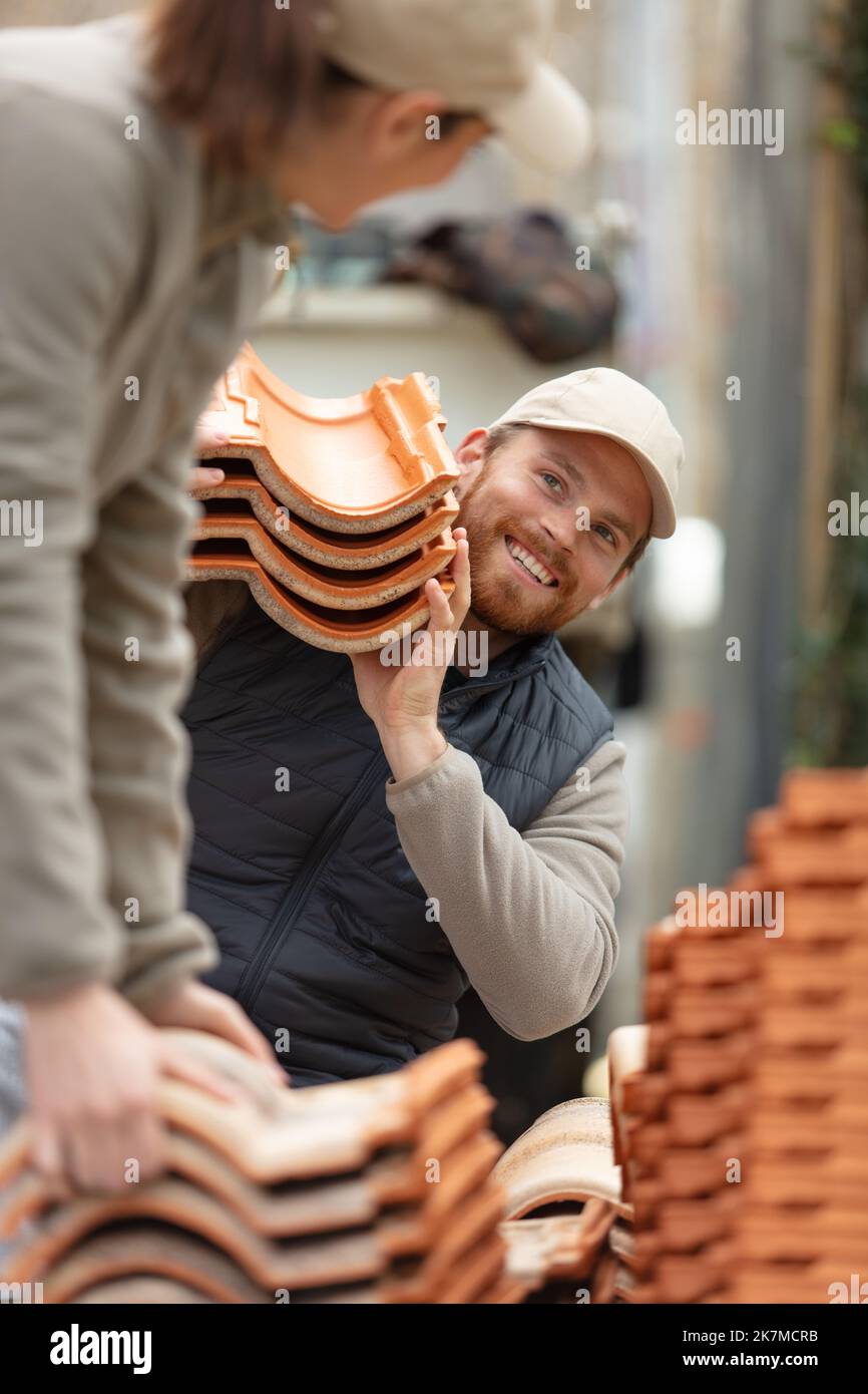portrait of mason bricklayer installing red brick Stock Photo - Alamy
