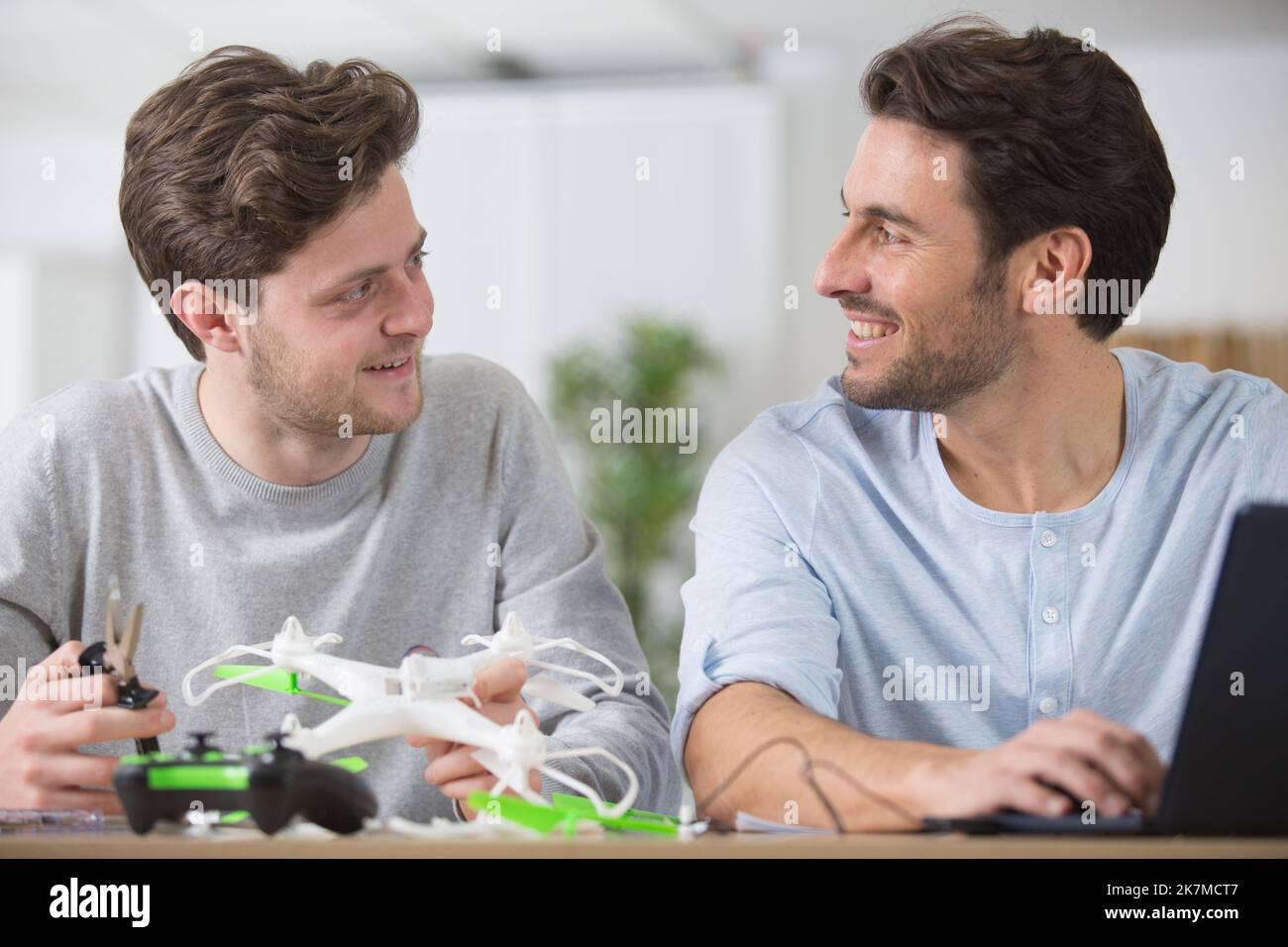 men fixing a drone Stock Photo - Alamy
