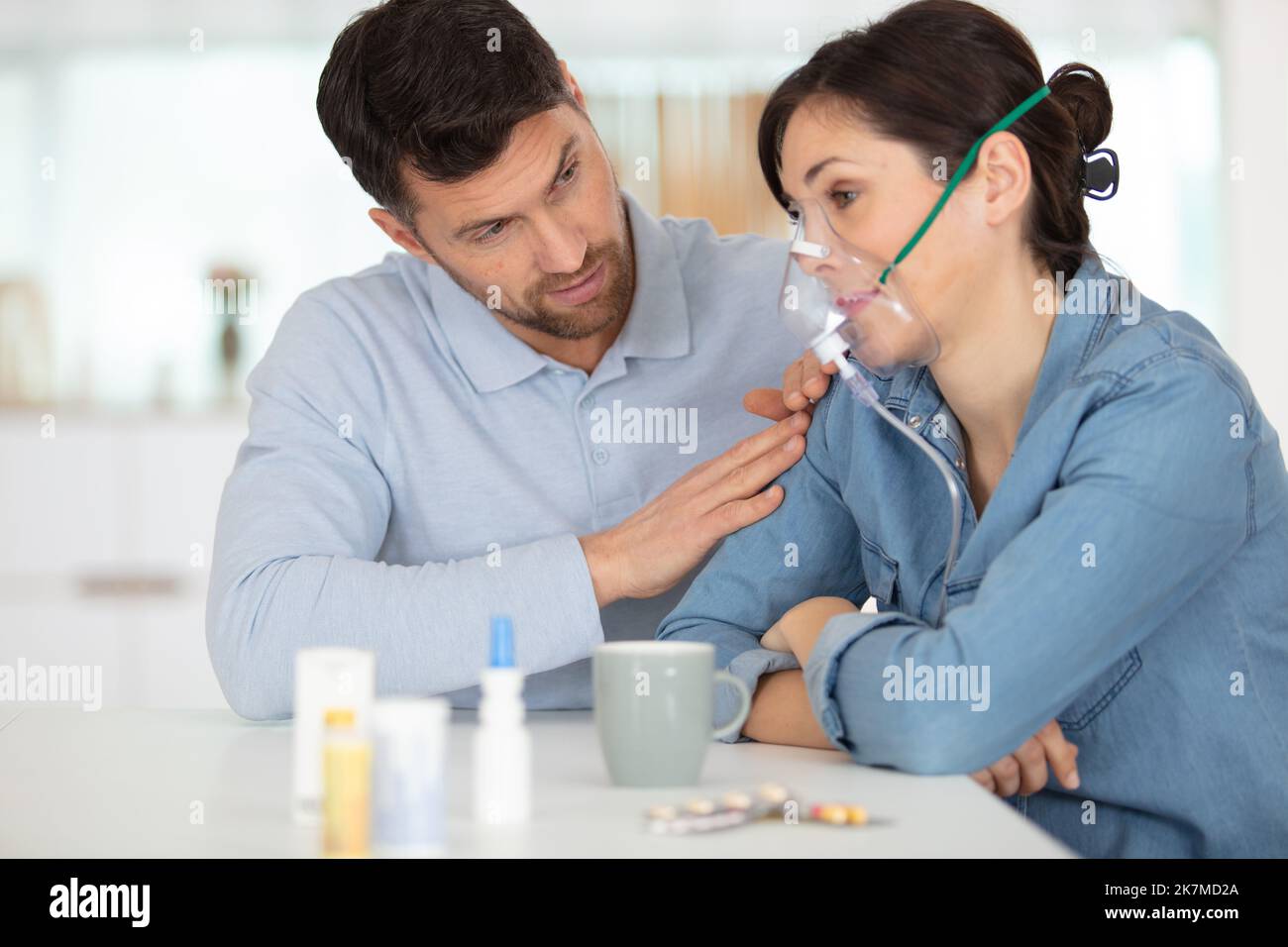 young male doctor using inhaler mask on woman Stock Photo - Alamy