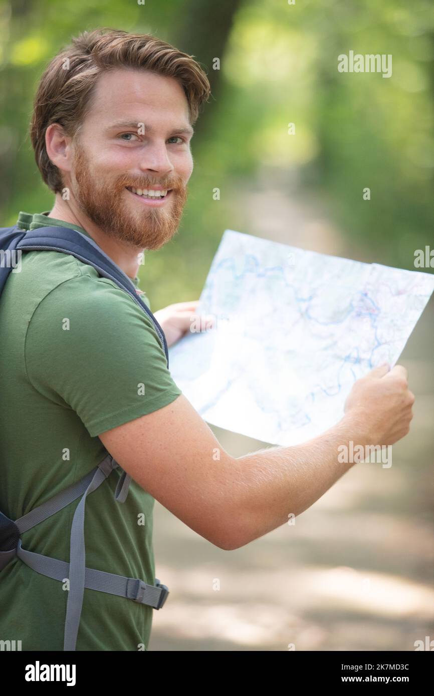 lost man observing map to find the the right way Stock Photo - Alamy