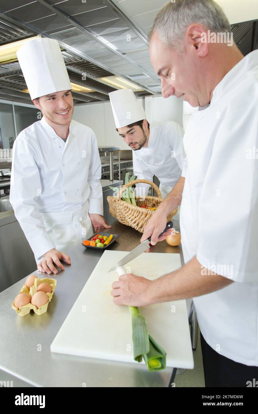 chefs cooking cutting and preparing next plate Stock Photo - Alamy