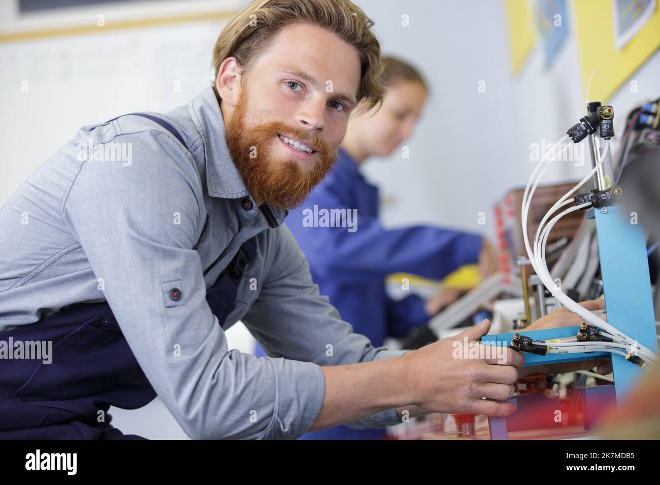 Male female asian engineers tablet hi-res stock photography and images - Alamy