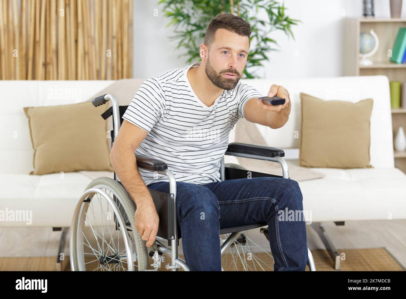 closeup of a man on a wheelchair watching tv a Stock Photo - Alamy