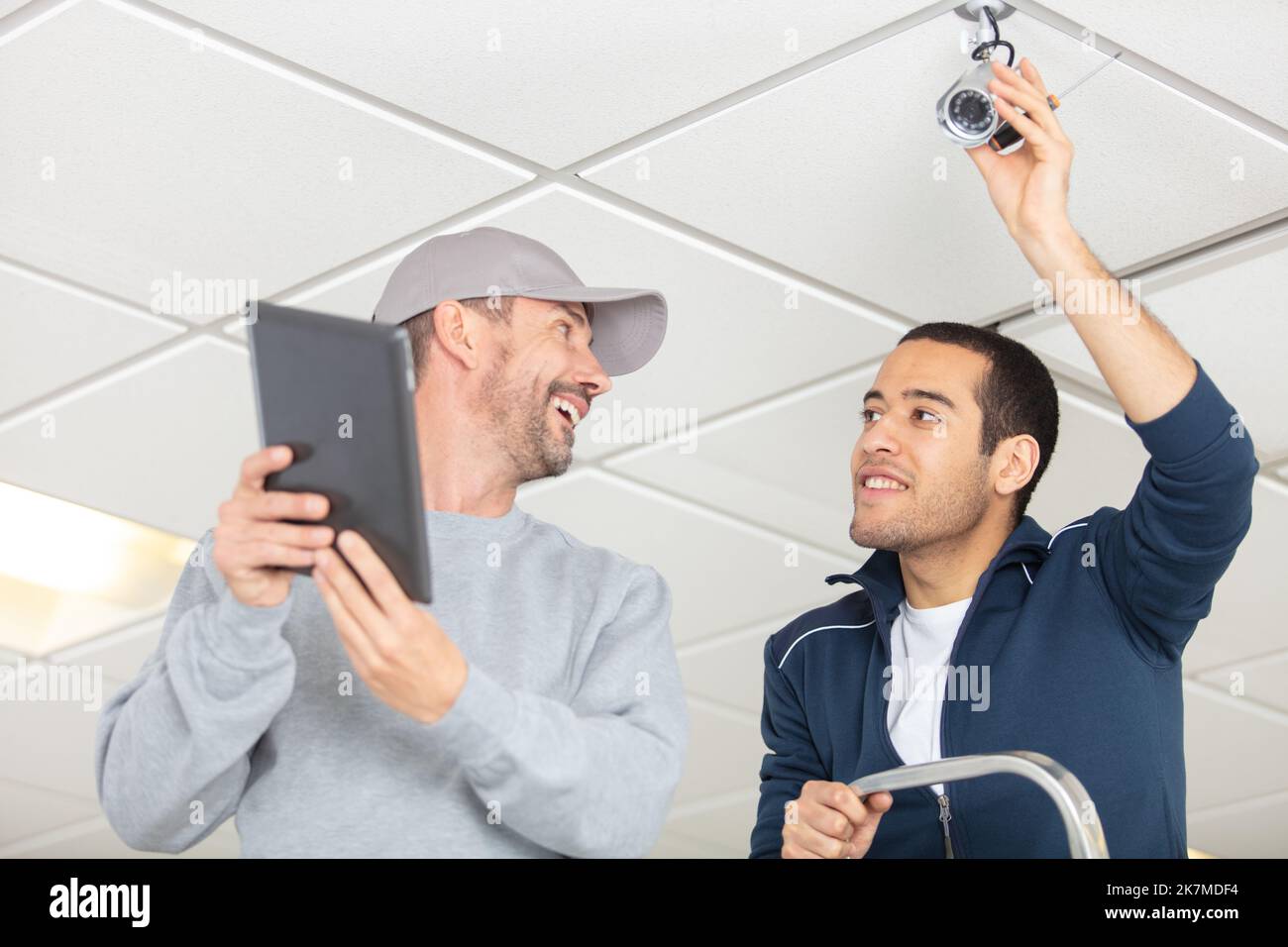 professional cctv technicians working together Stock Photo - Alamy