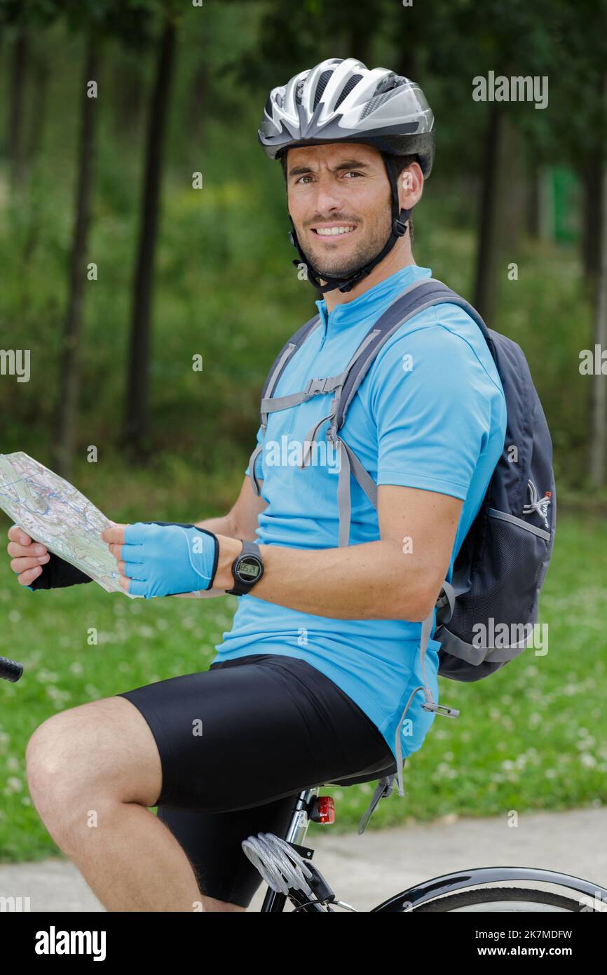 Cyclist holding map hi-res stock photography and images - Alamy