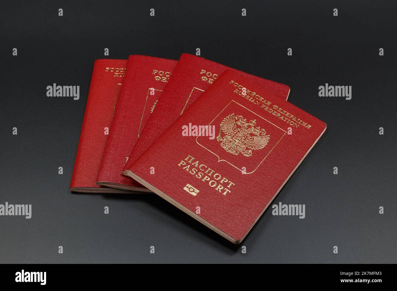 Four Russian foreign passports on a dark background Stock Photo - Alamy
