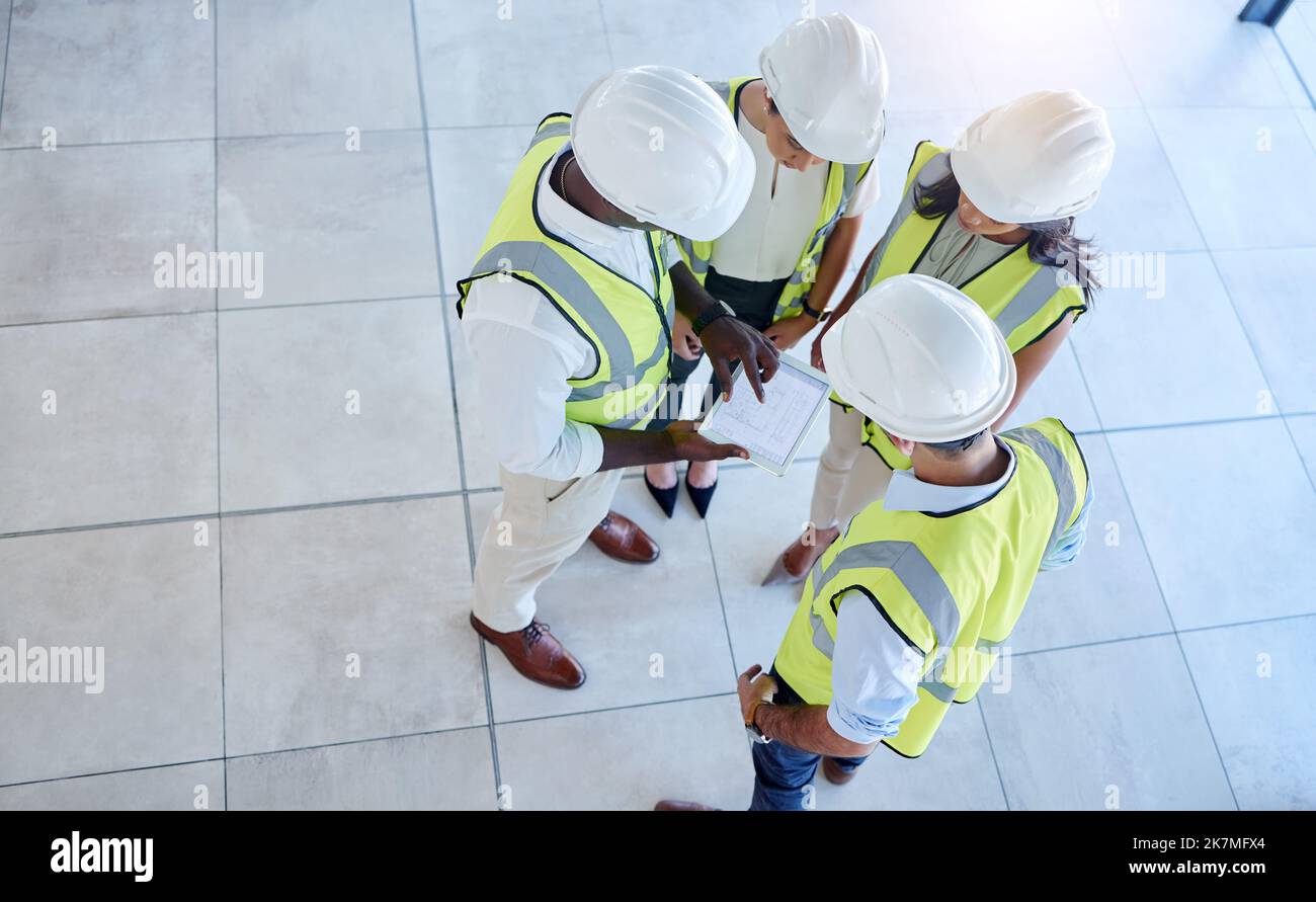 Architecture Engineering And Design Team Use Tablet For Planning Building Construction On