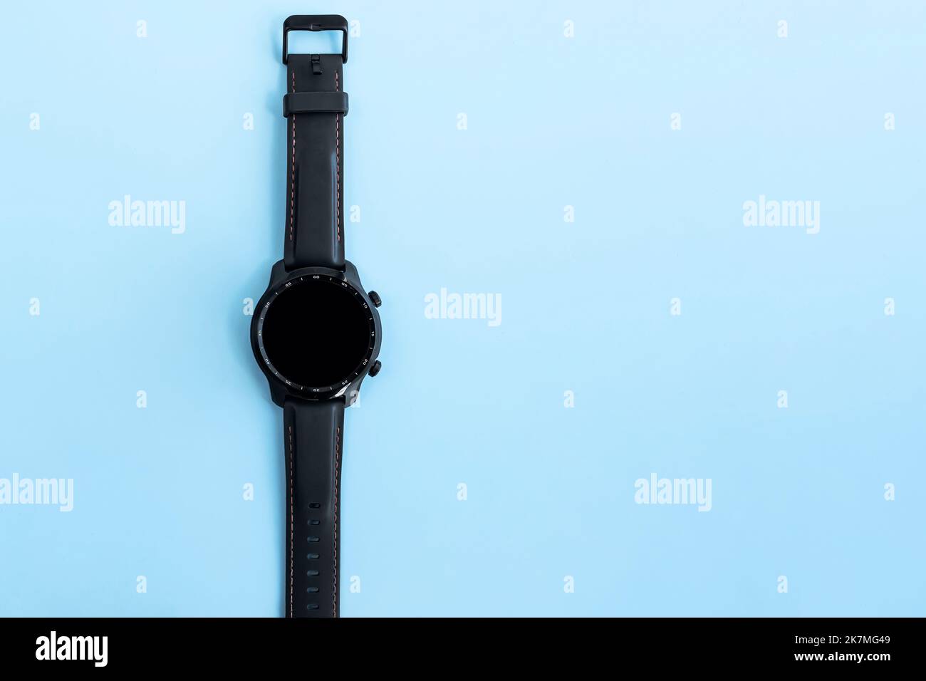 Black smartwatch on blue background. Watch for training info, running ...
