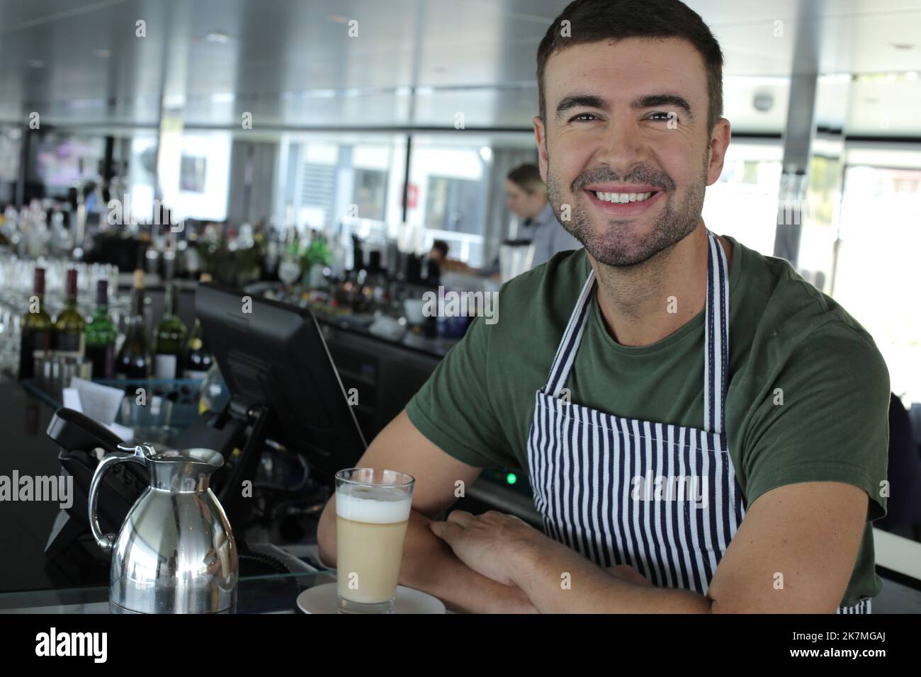 Restaurant worker with apron portrait Stock Photo - Alamy