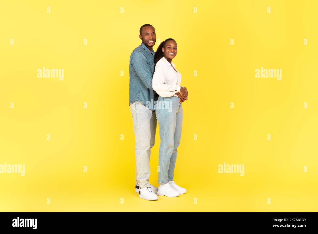 Happy Black Couple Hugging Posing Smiling To Camera, Yellow Background ...