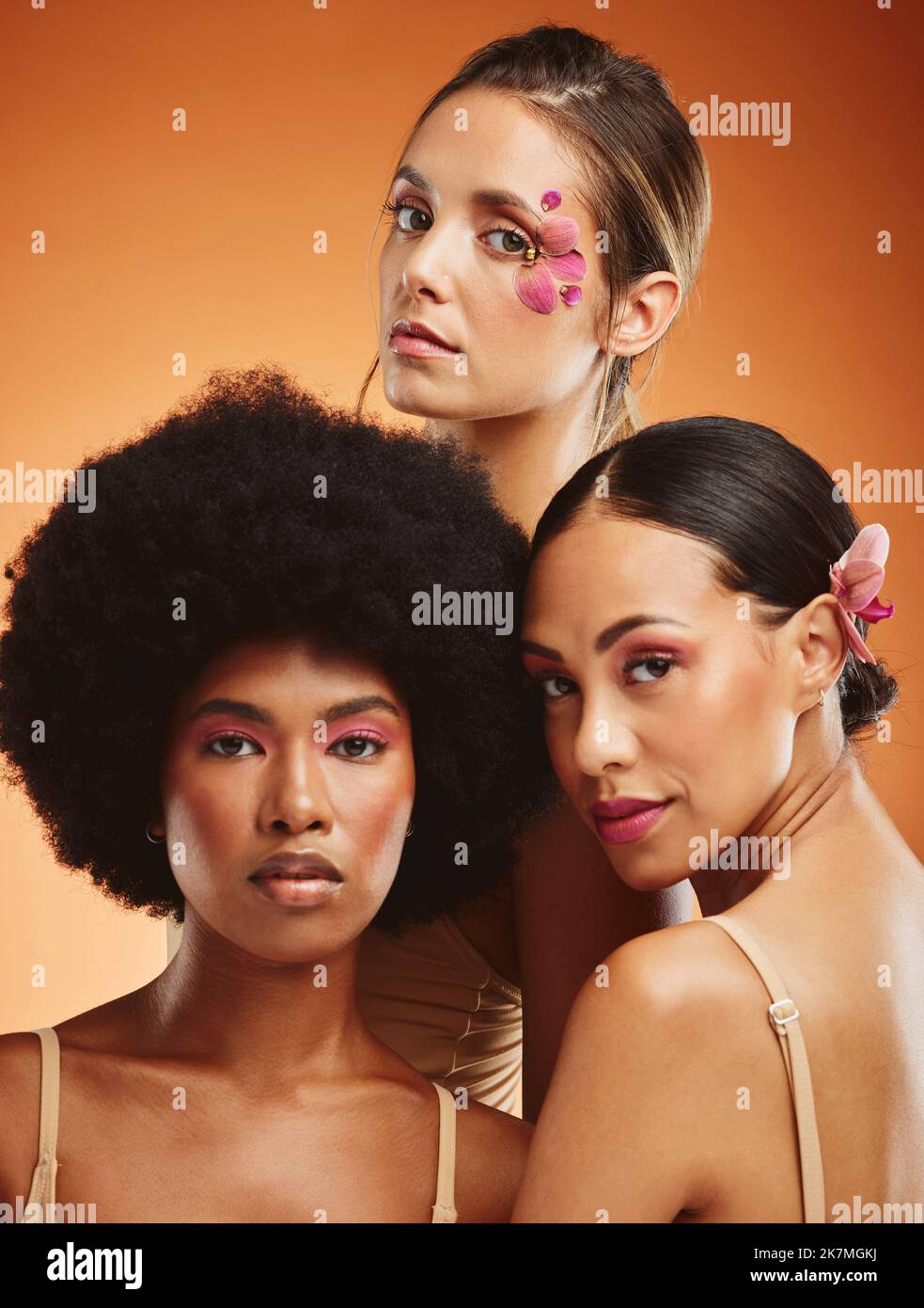 Portrait, flowers and women with makeup for spring against an orange ...