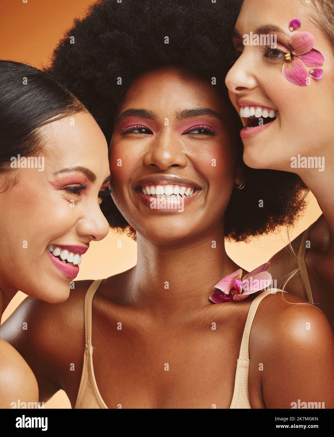 Women, beauty and flowers, makeup and diversity of models on orange ...