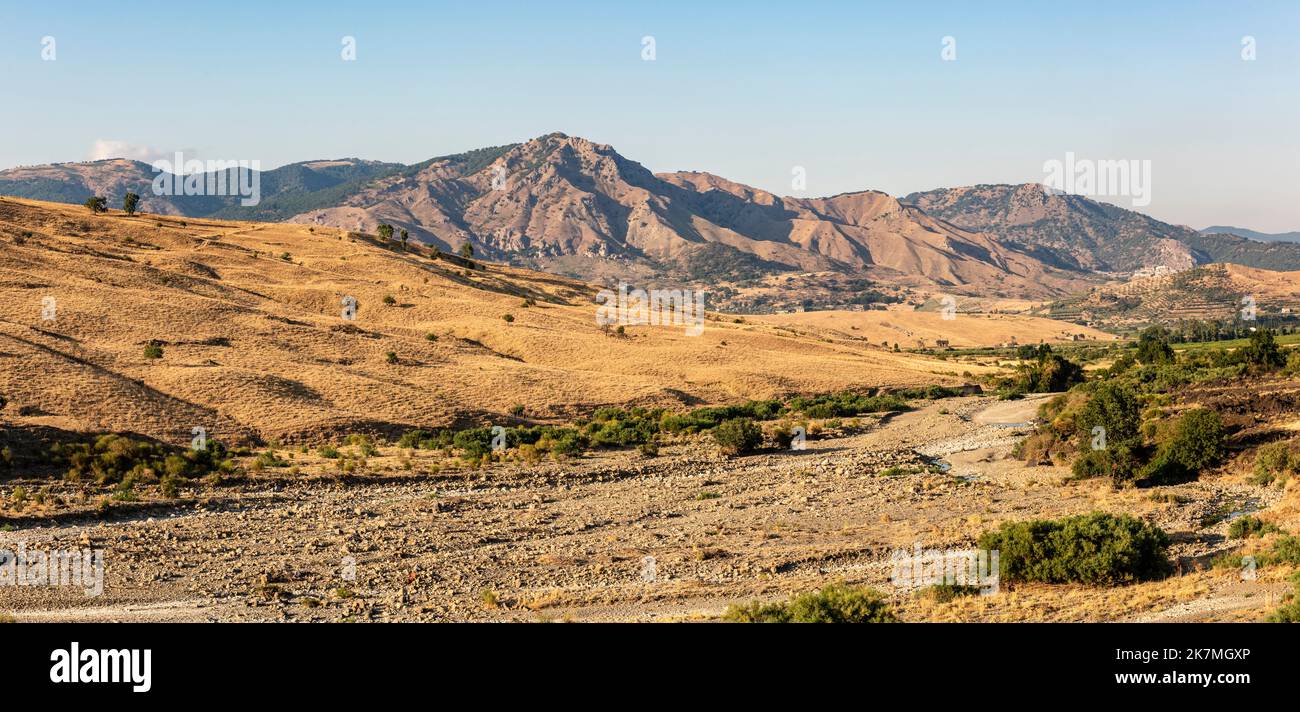 The harsh Sicilian countryside in high summer. A view across the valley ...