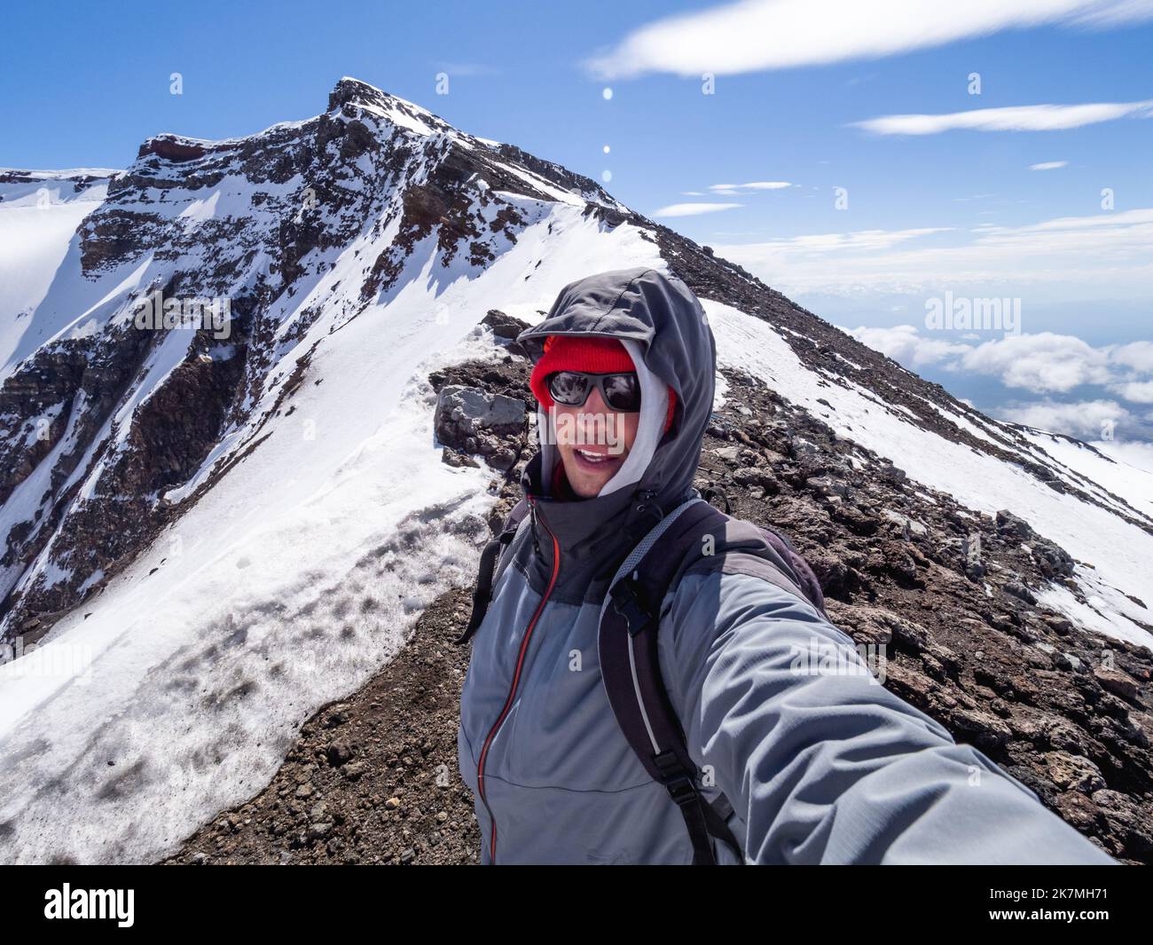 Man makes selfie on caldera of Plosky Tolbachik stratovolcano. Hiking ...