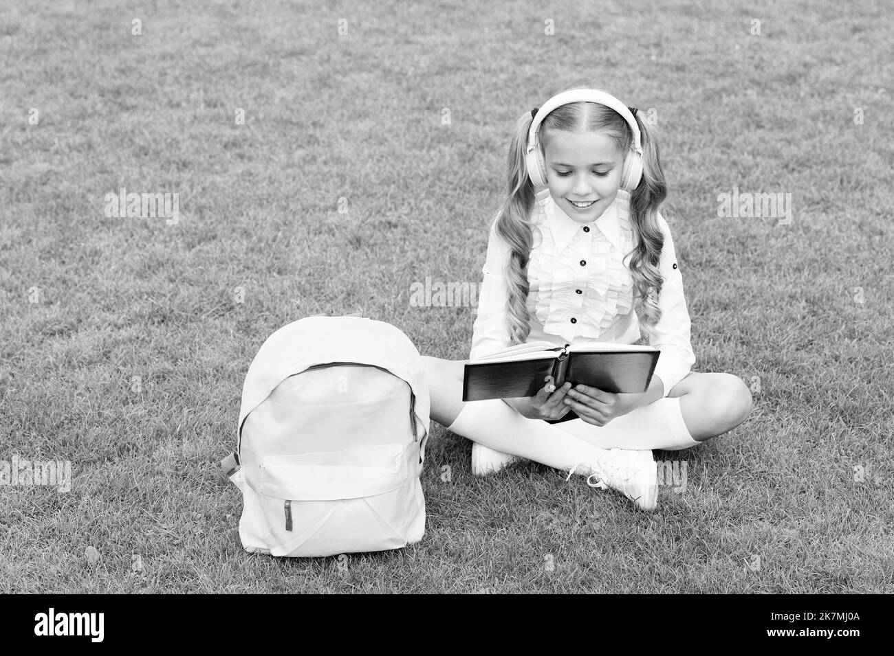 Language learning course. Girl child learn English sitting on green ...