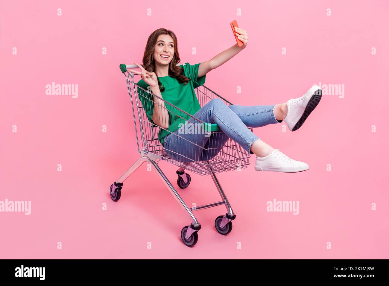 Photo of funny cute lady buyer client sit cart look camera make ...