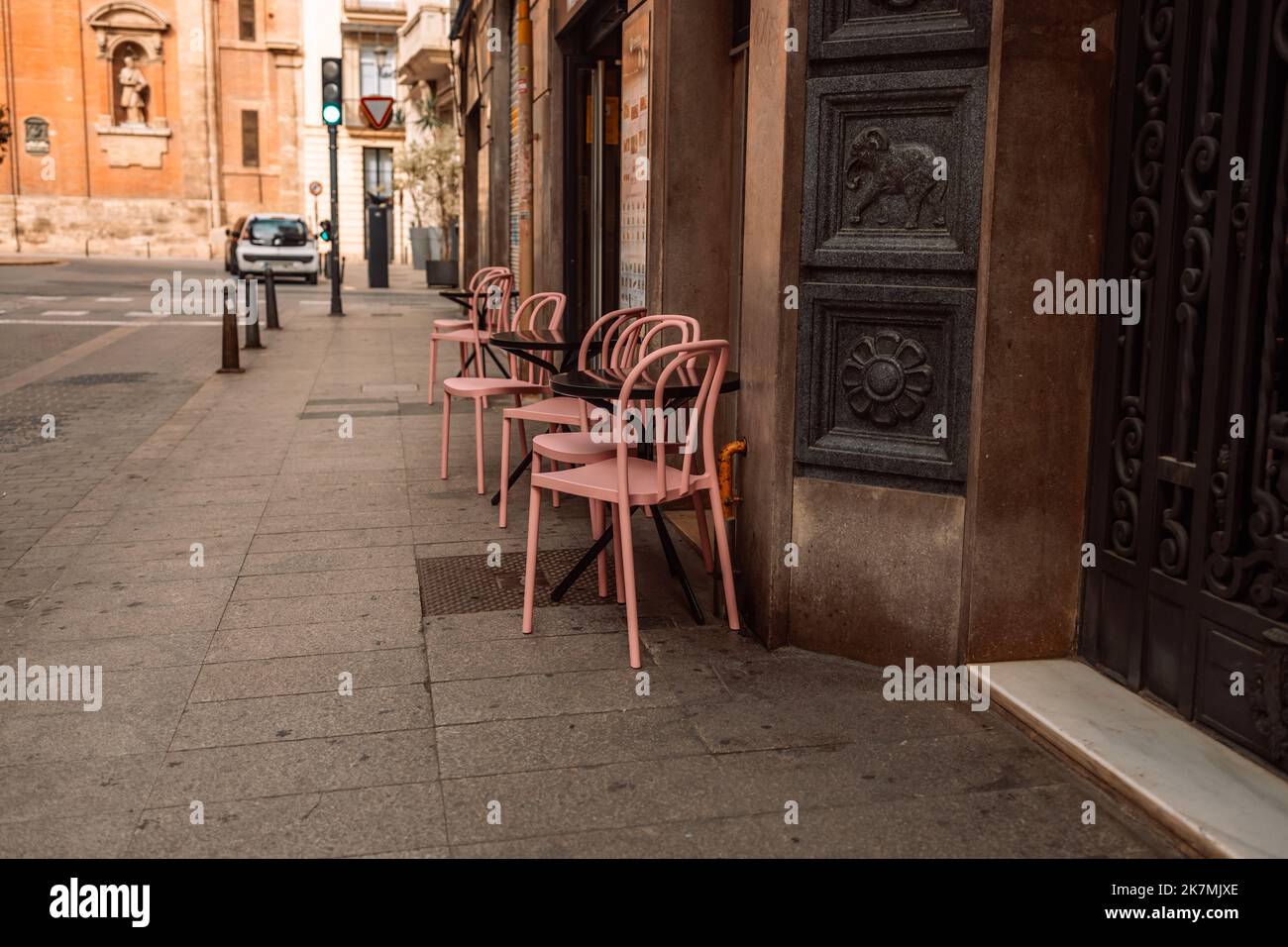Street view with summer cafe terrace during the morning in Valencia ...