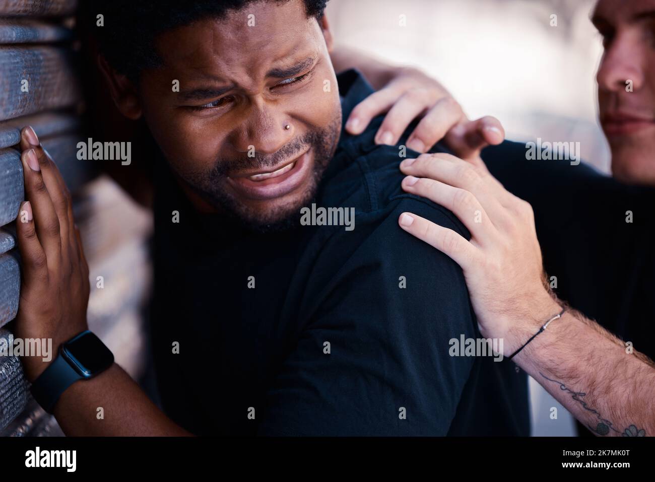Police, crime and search with suspect being arrested in a street ...