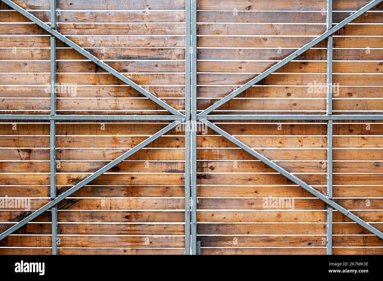 Wooden gate of horizontal boards on metal frame as background. Gate ...