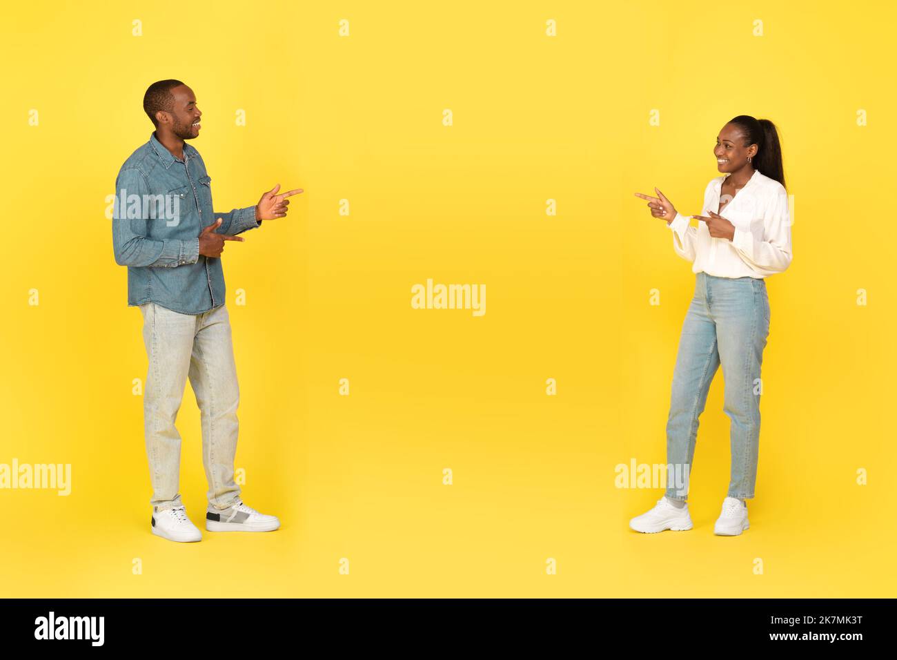 Man and woman pointing at each other hi-res stock photography and ...