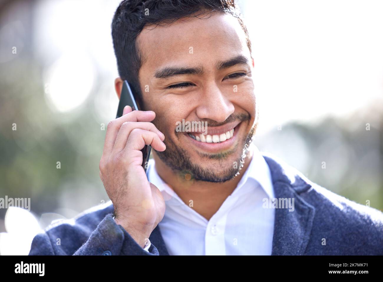 Youre always on my mind. a businessman using his smartphone to make a ...