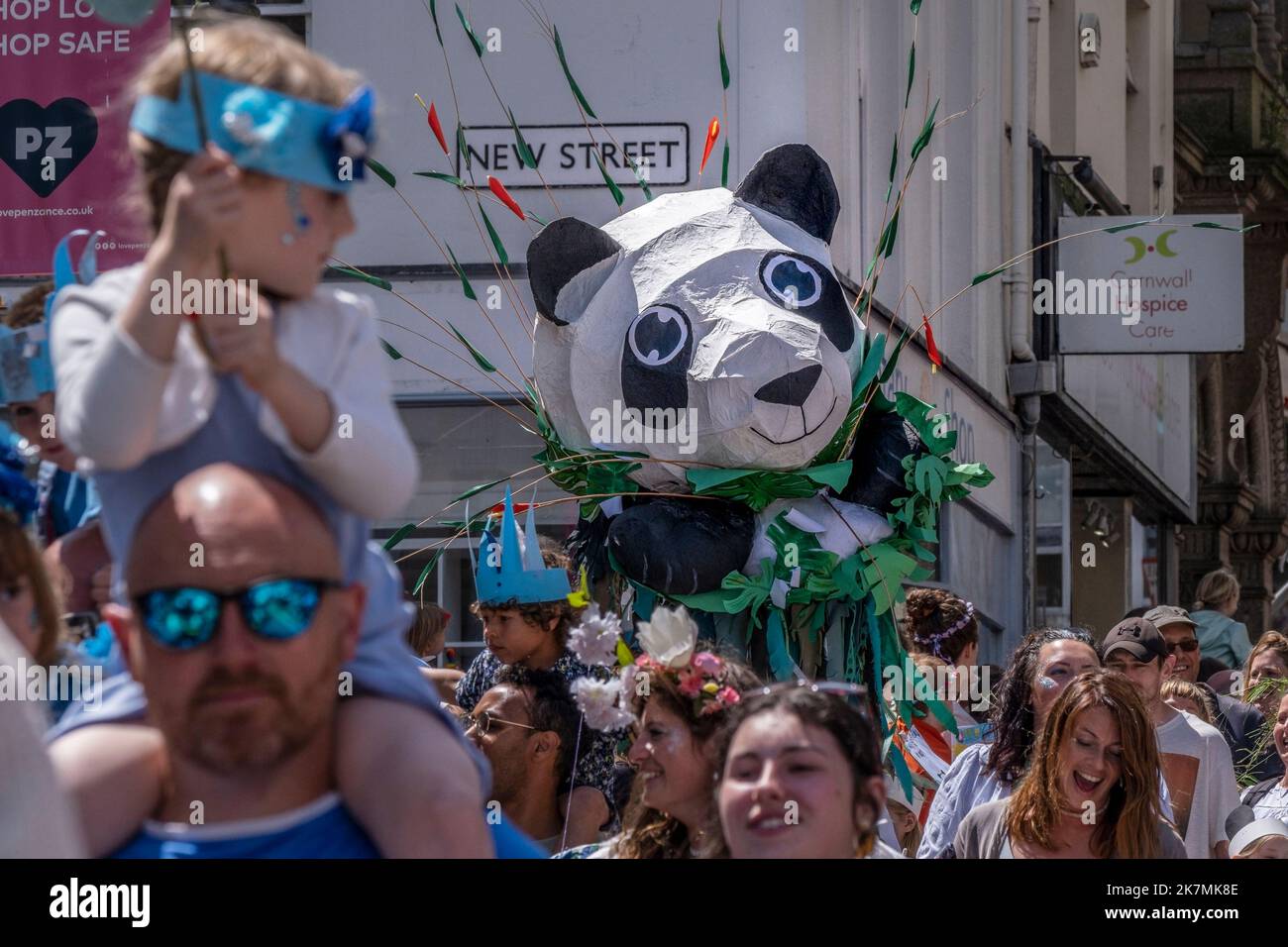 People carrying a large withy and paper structure of a Panda in the ...