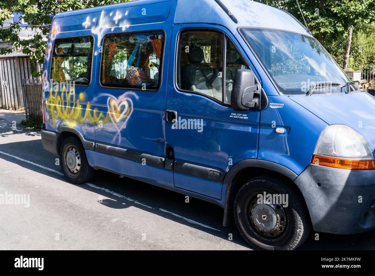 Graffiti sprayed on the side of a vehicle parked in a street in Newquay ...