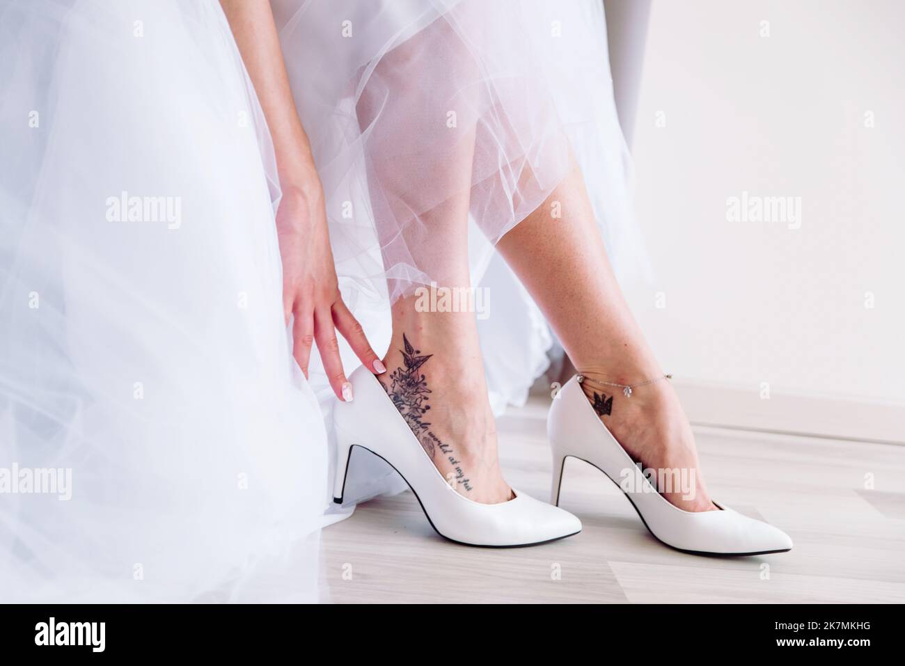feet of bride and groom, wedding shoes (soft focus). Cross processed ...