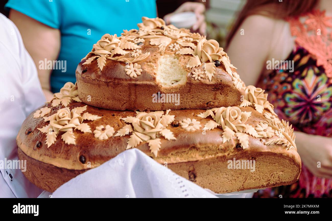 Wedding bread - loaf (cake). Wedding bread. A loaf is decorated with flowers, stables, ears of ...