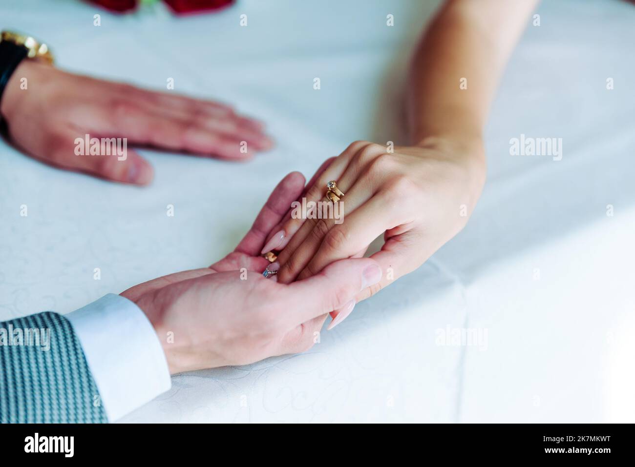 Picture of man and woman with wedding ring.Young married couple holding ...
