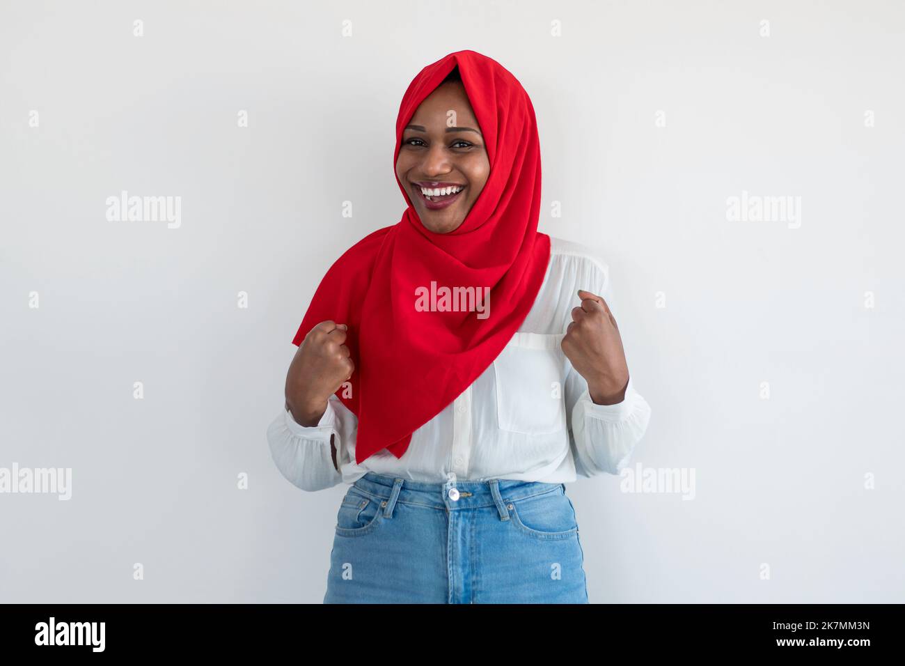 Cheerful african american woman in hijab gesturing yes, celebrating ...