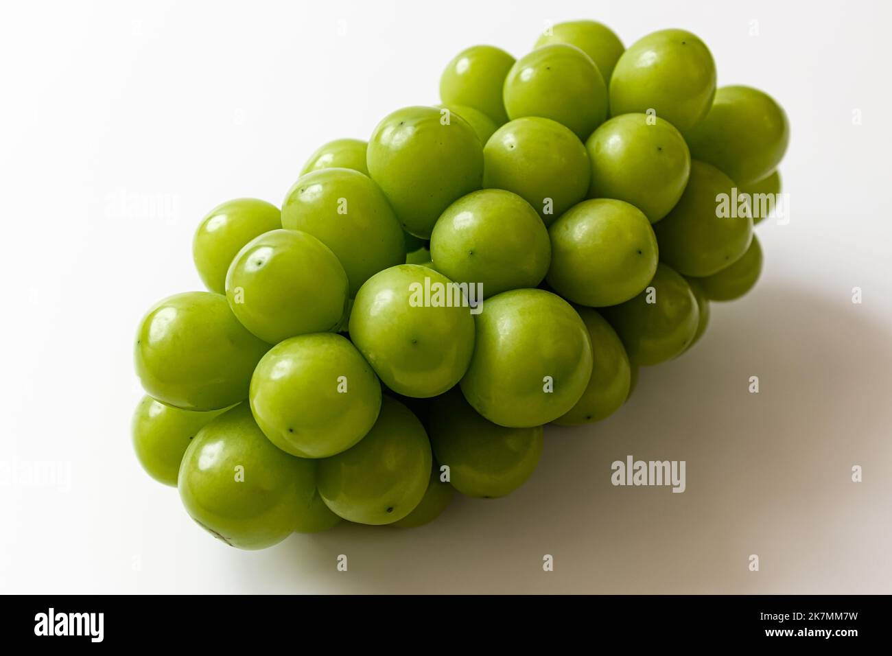 Shine Muscat on a white background Stock Photo - Alamy